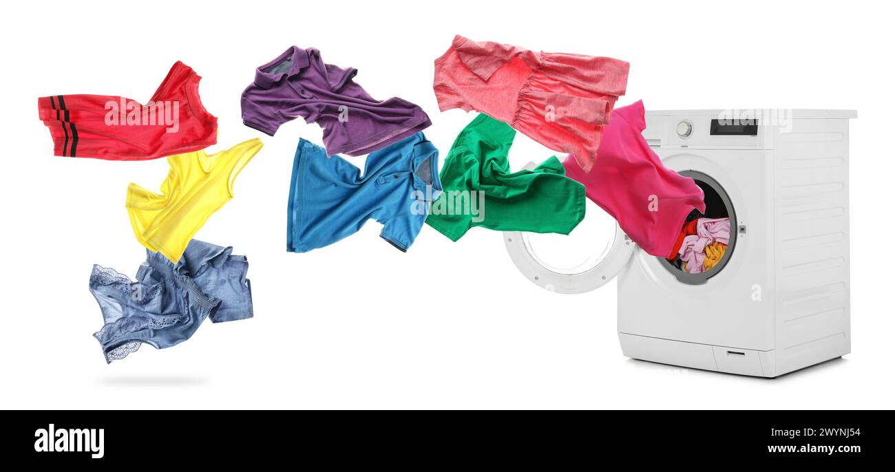 Washing machine and flying clothes on white background Stock Photo - Alamy