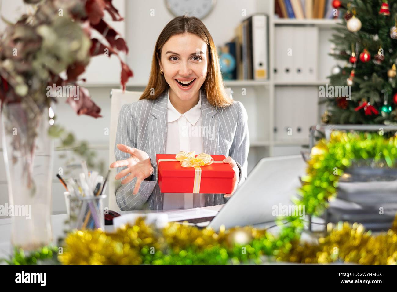 Woman receiving present in box before Christmas Stock Photo - Alamy