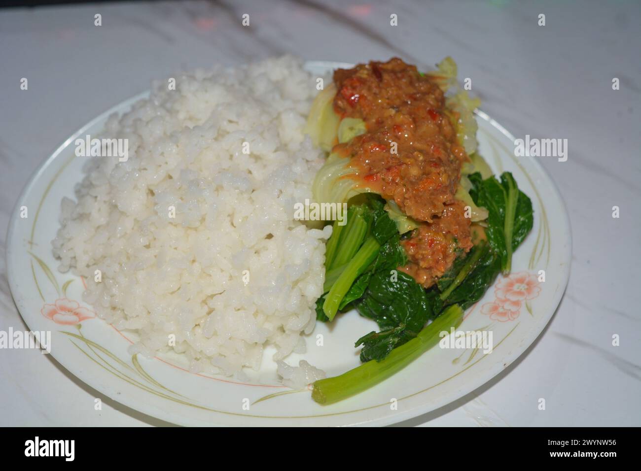 A plate of pecel rice, on a white background Stock Photo - Alamy