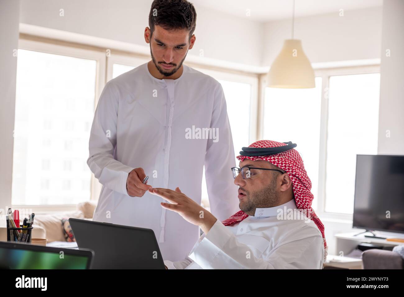 Arab people asking at work hi-res stock photography and images - Alamy