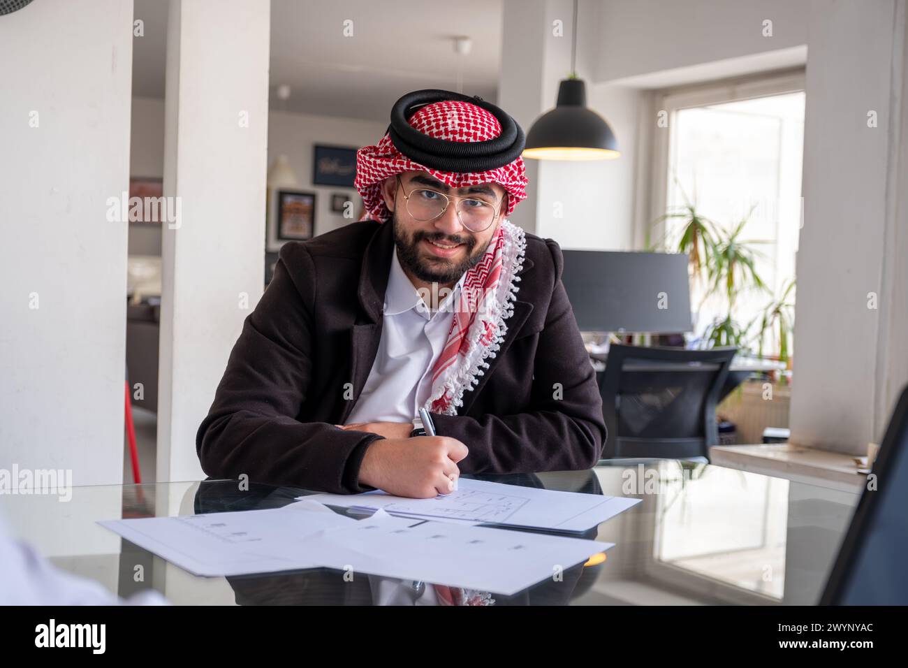 Office working people working in uae hi-res stock photography and ...
