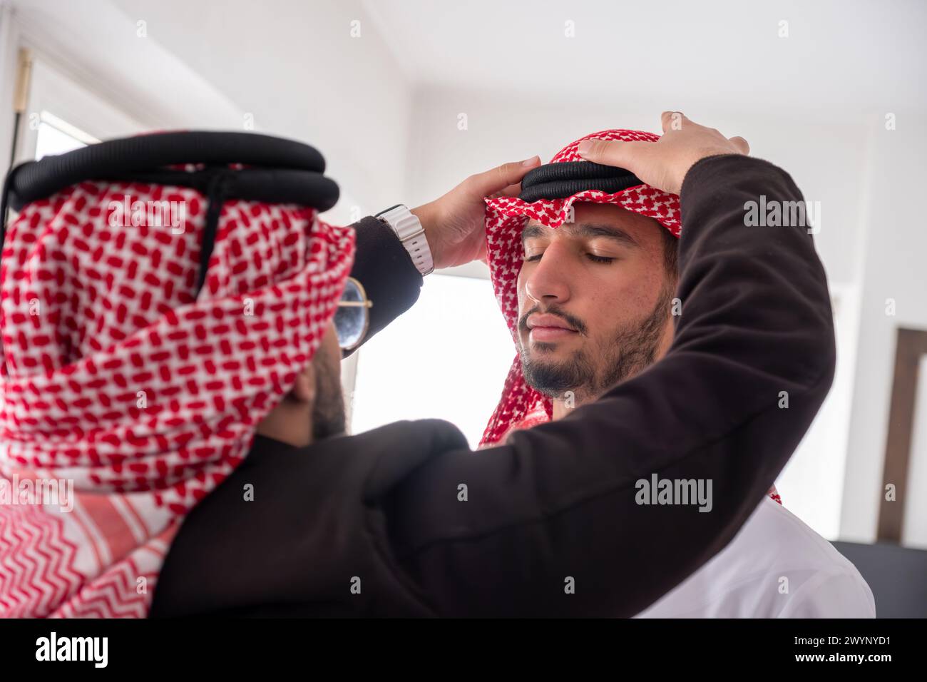 arab support each other even in wears Stock Photo - Alamy