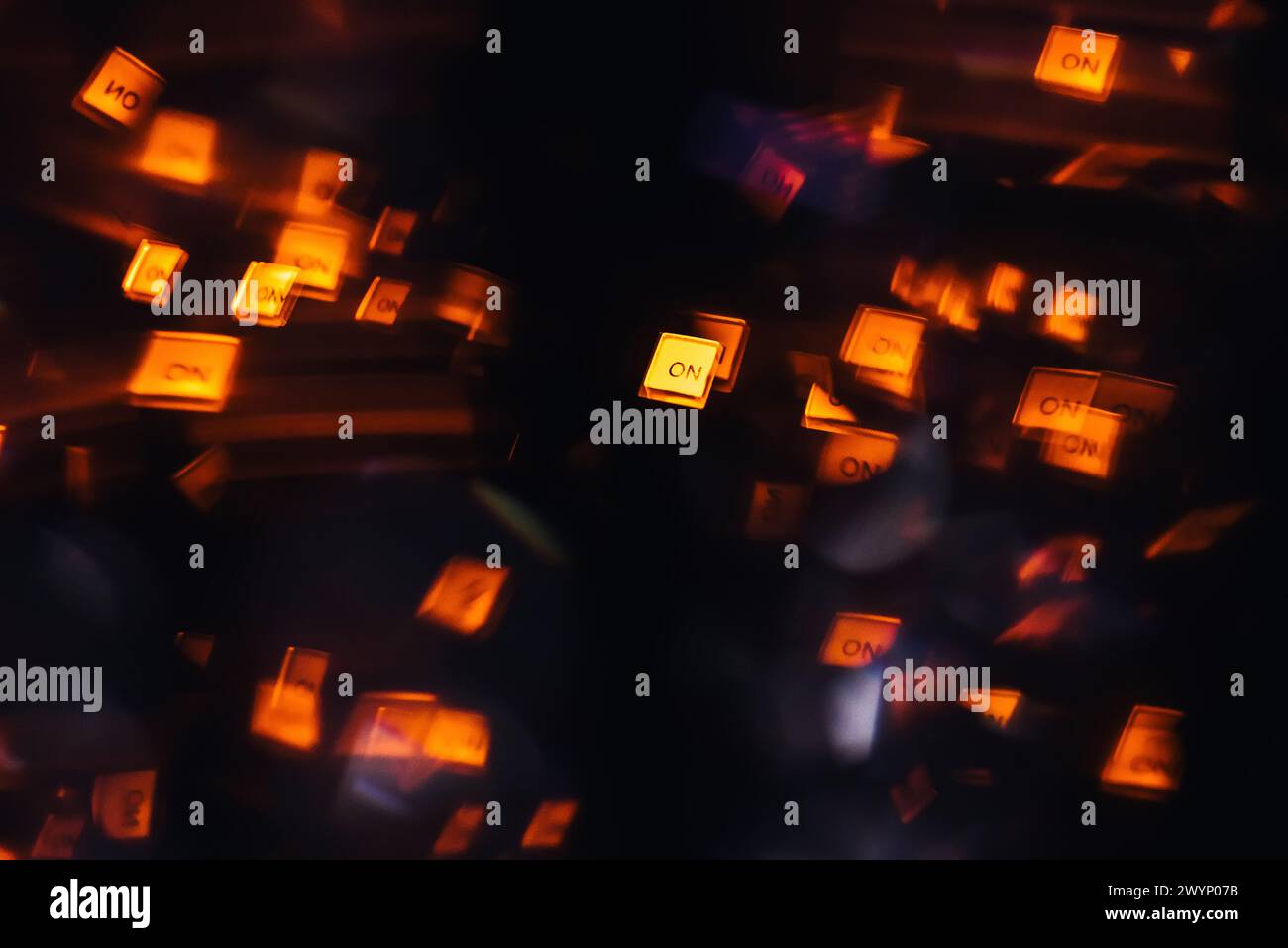 DJ mixer in a nightclub with glowing colored lights from controllers ...