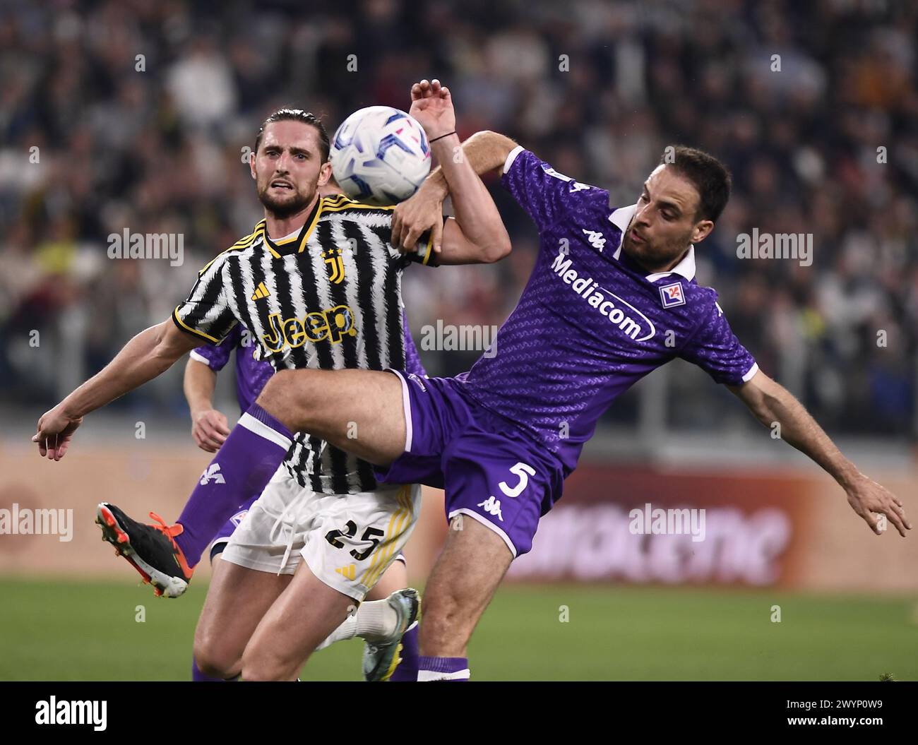 Turin, Italy. 7th Apr, 2024. Juventus's Adrien Rabiot (L) vies with ...