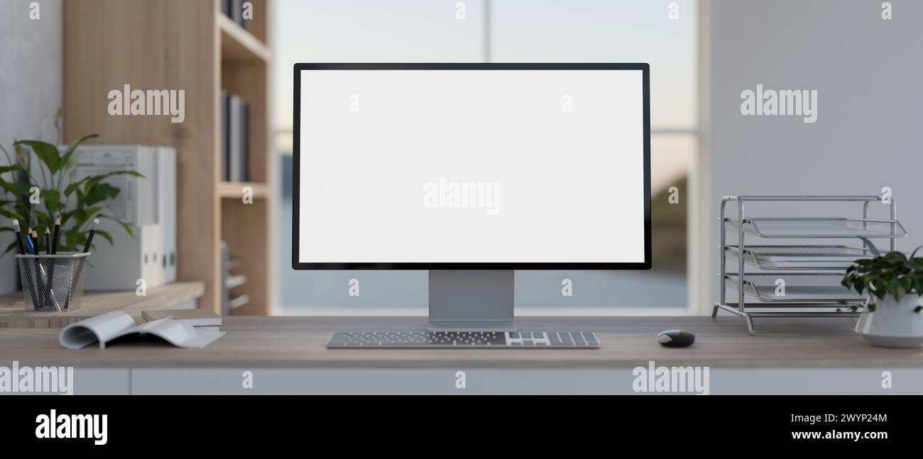 A front view of a white-screen PC computer mockup and office supplies ...