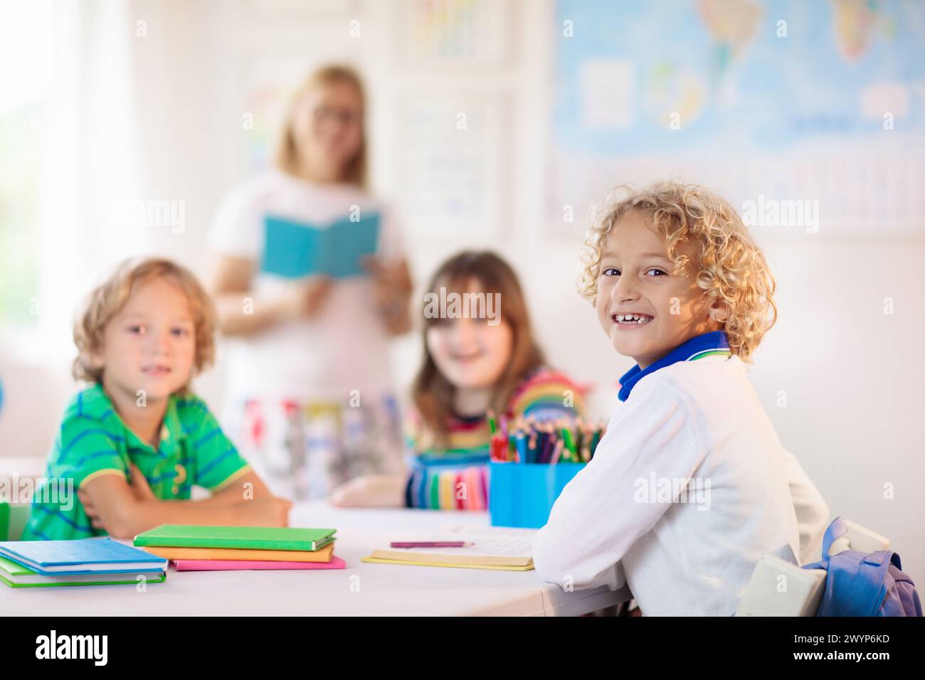 Kids in school. Preschool children in class. Happy kids back to school ...