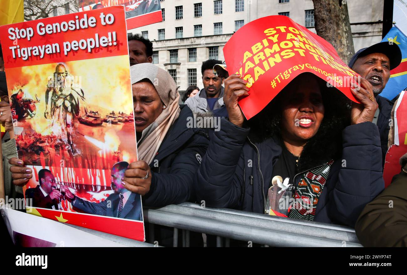 A protester holds a placard demanding the genocide of the Tigrayan ...