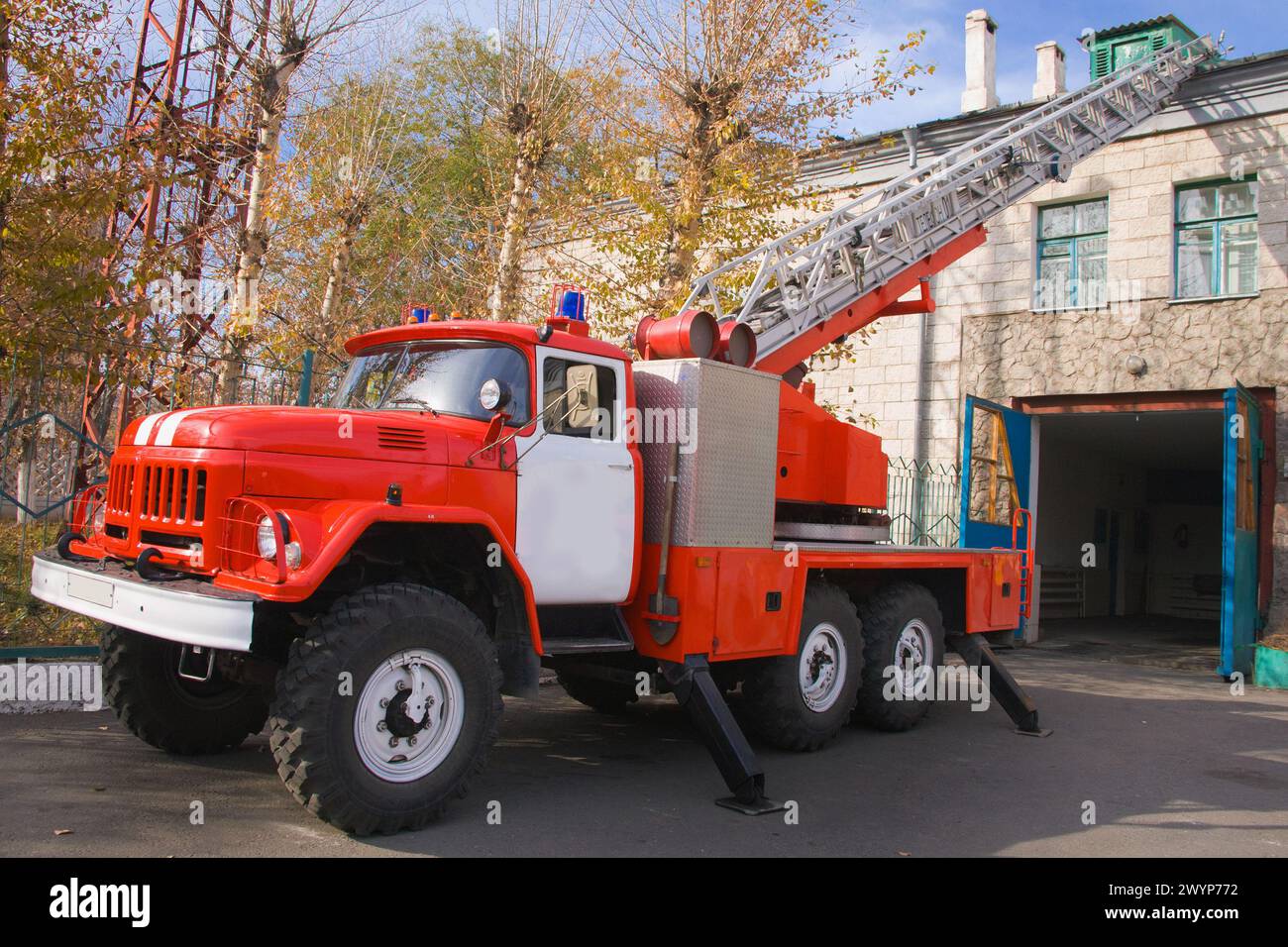 A large soviet red fire truck ZIL is preparing to leave Stock Photo - Alamy