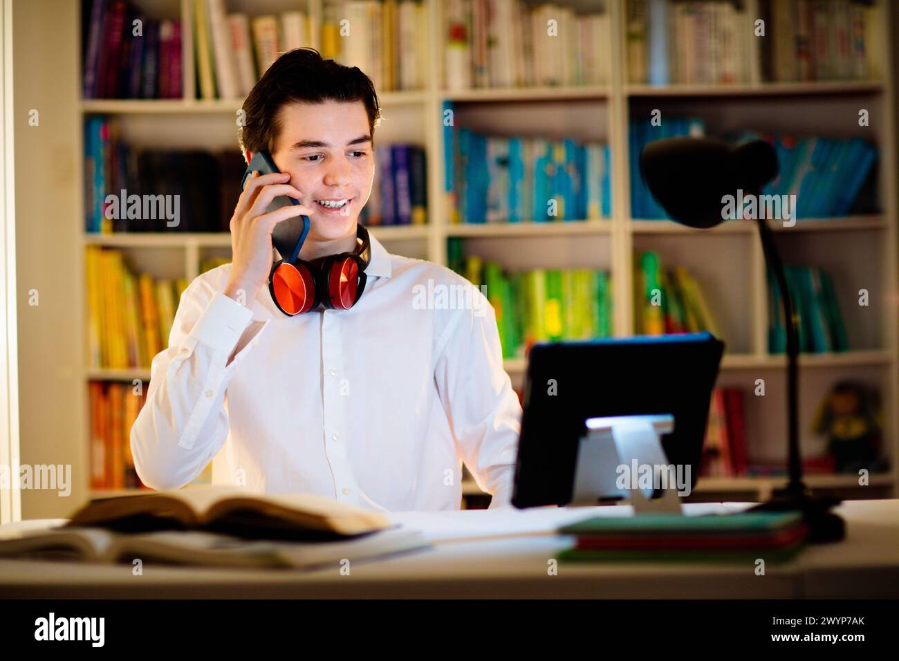 Teenage student at laptop. Online remote learning in high school or ...