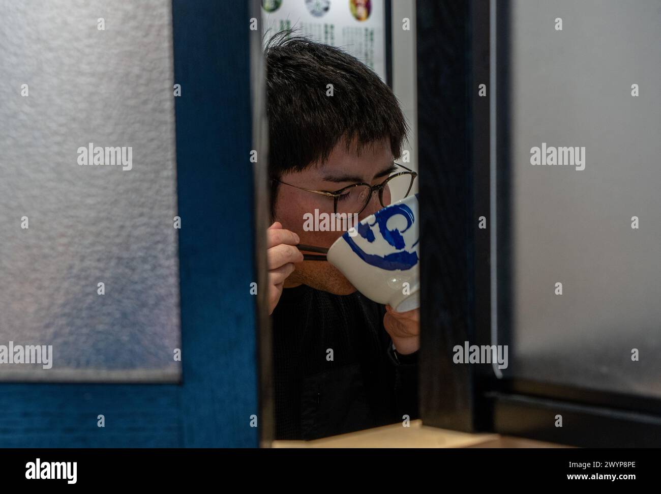 Customers eating at a fast food ramen restaurant in Osaka,Japan Stock ...