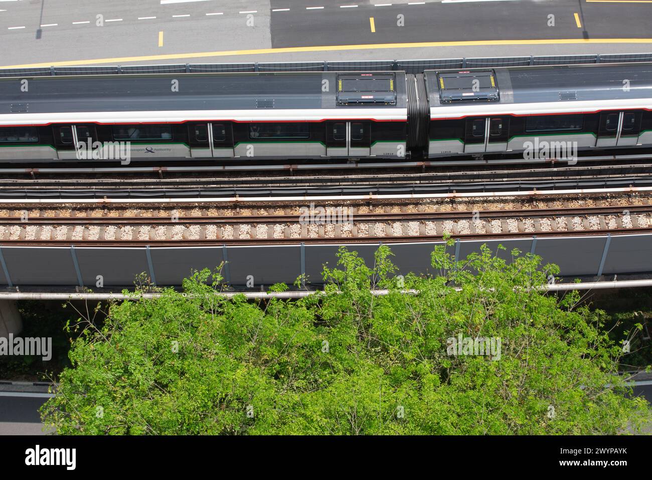 Aerial view of an operational train on track. Commuting the passengers ...