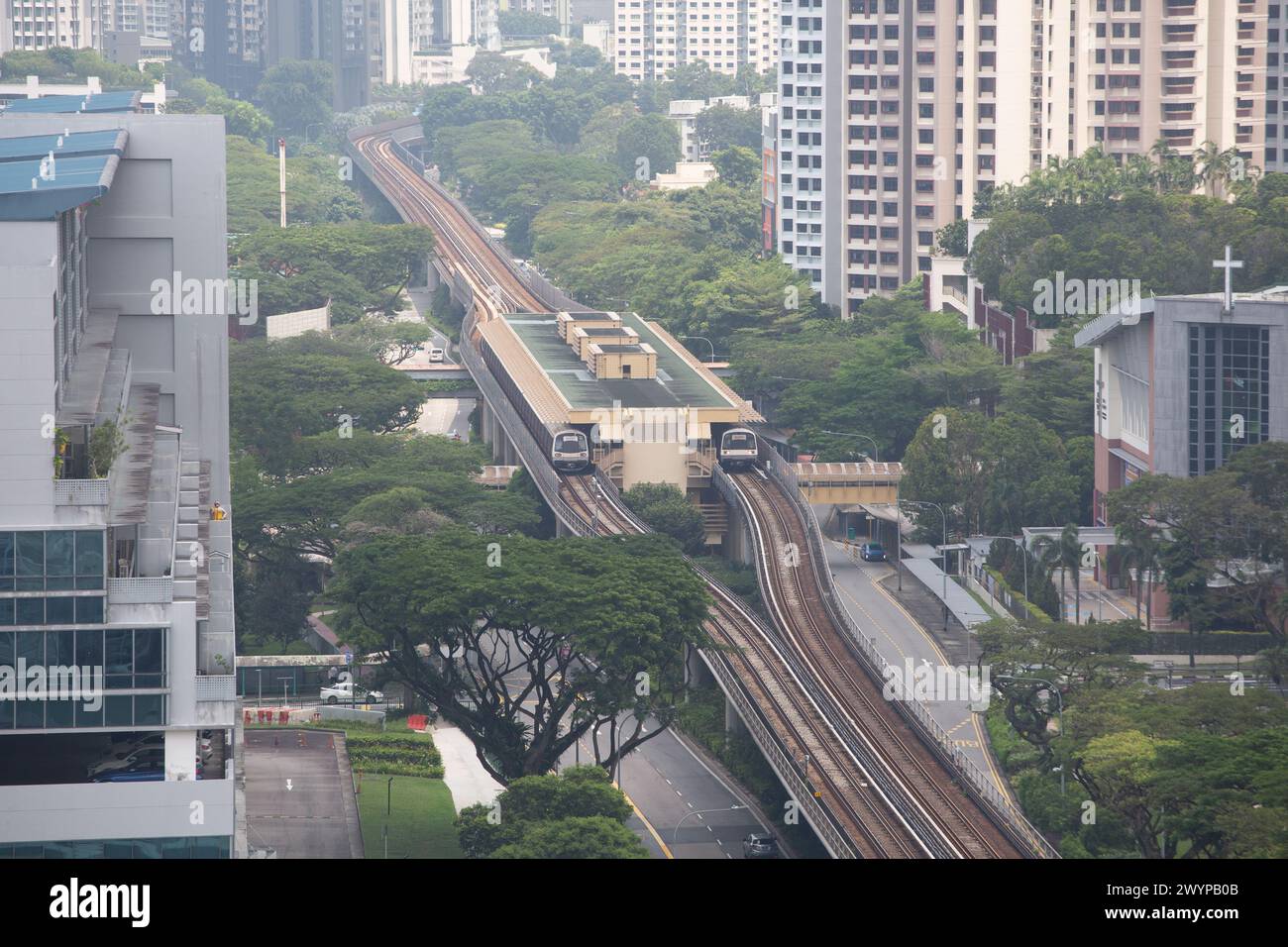 Two trains at Commonwealth train station. Towering architectural ...