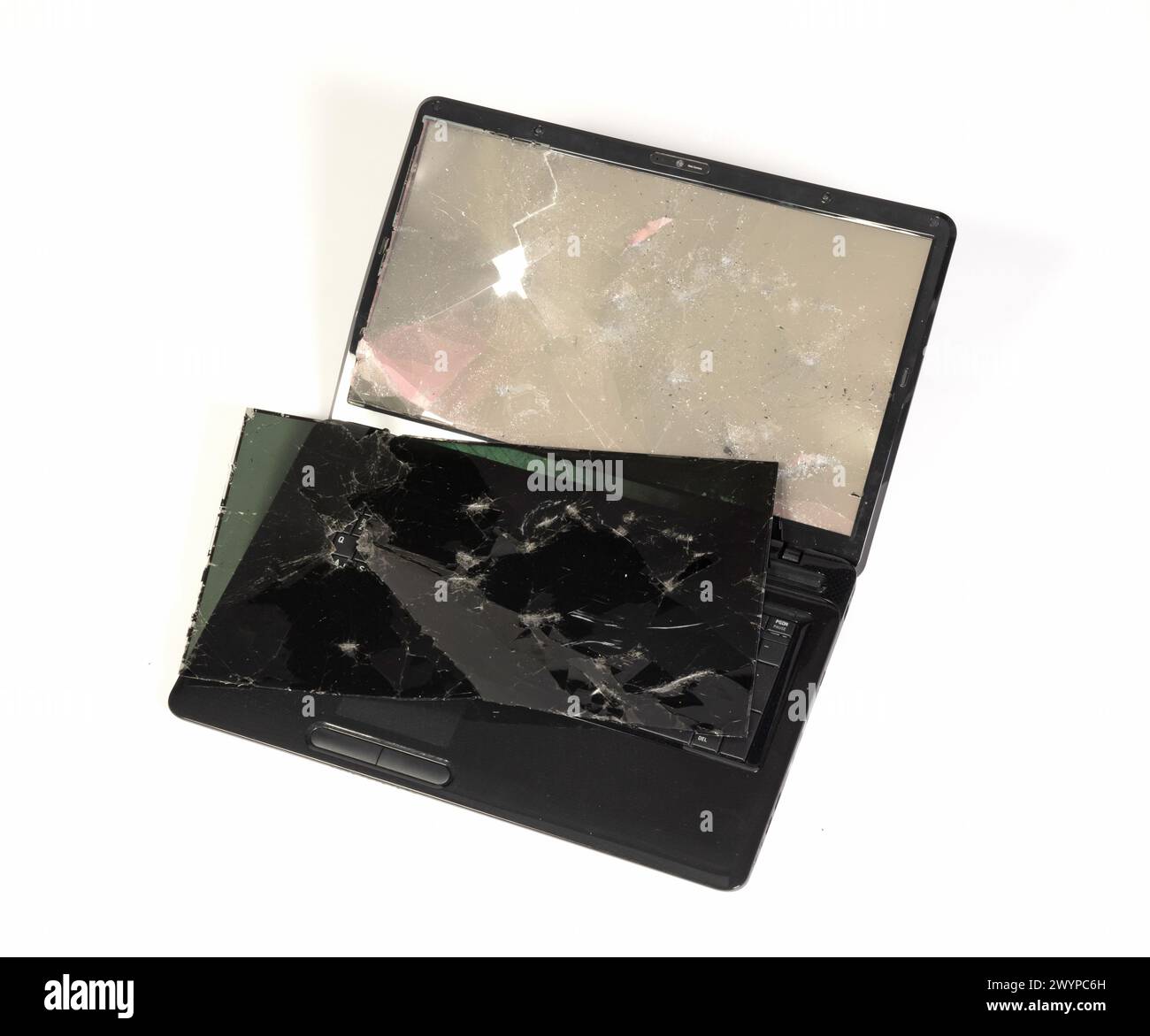 Old broken laptop isolated on white a background Stock Photo - Alamy