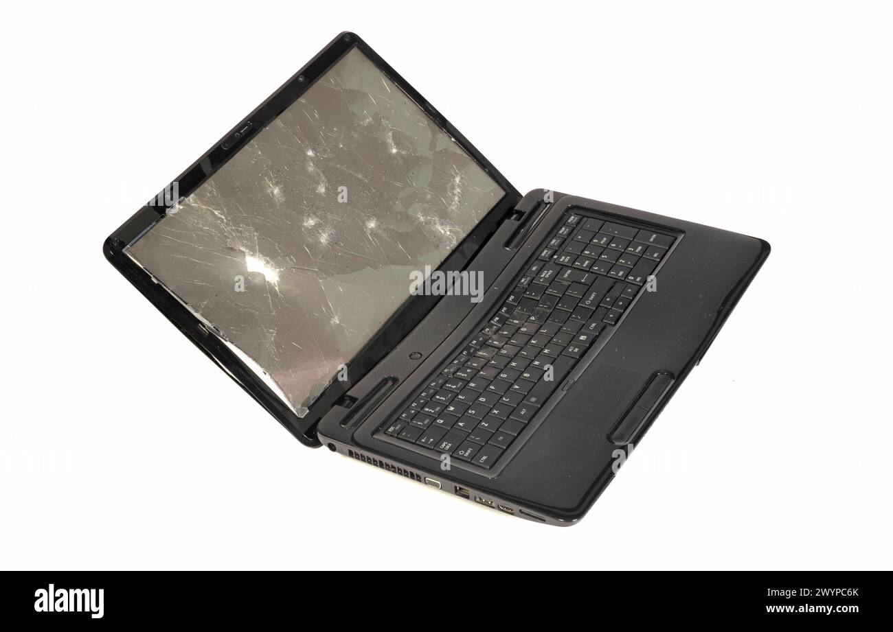 Old broken laptop isolated on white a background Stock Photo - Alamy