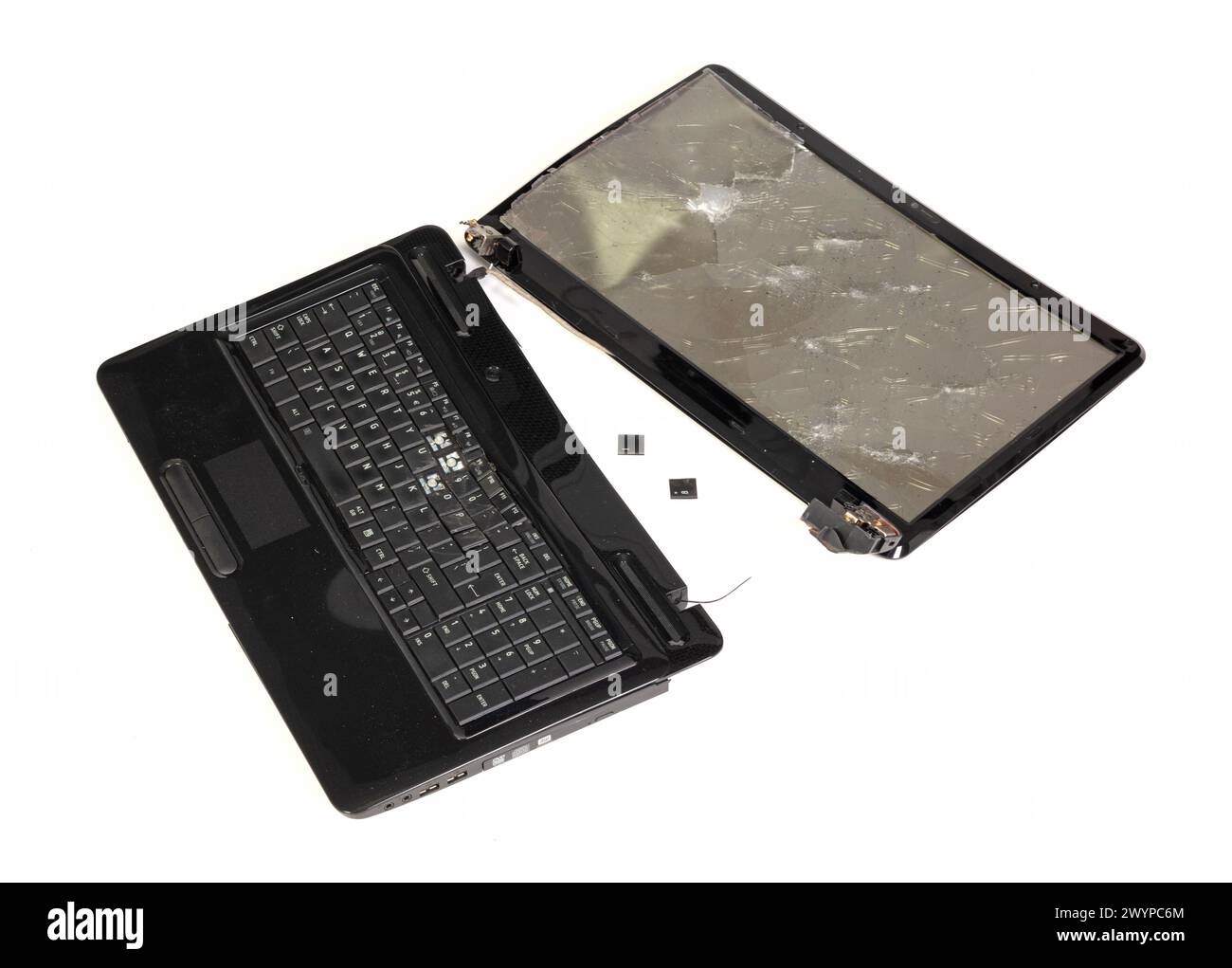 Old broken laptop isolated on white a background Stock Photo - Alamy