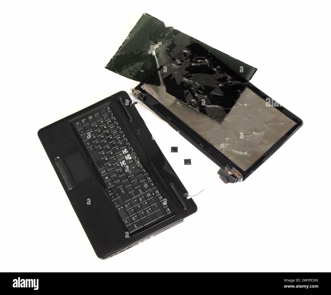 Old broken laptop isolated on white a background Stock Photo - Alamy