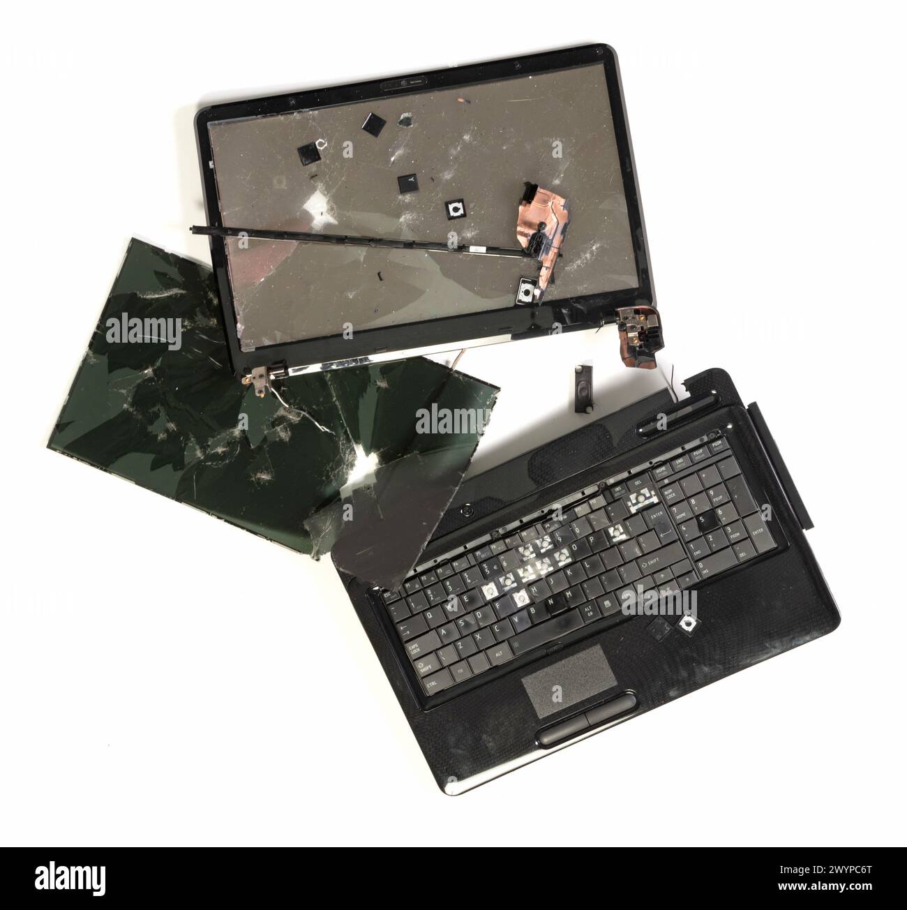 Old broken laptop isolated on white a background Stock Photo - Alamy