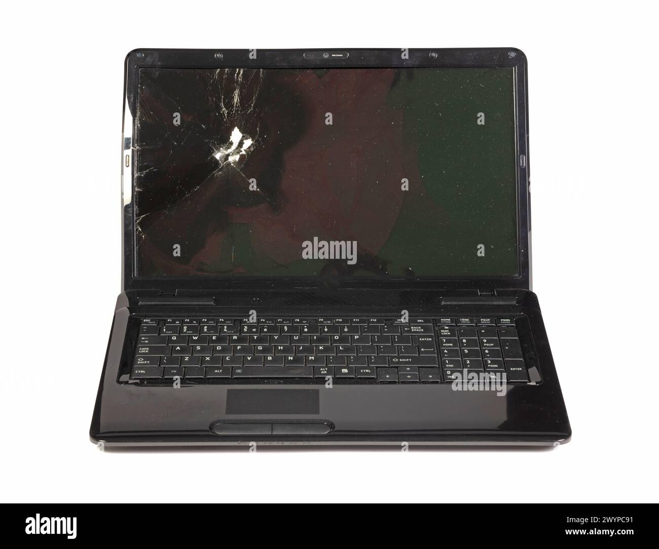 Old broken laptop isolated on white a background Stock Photo - Alamy