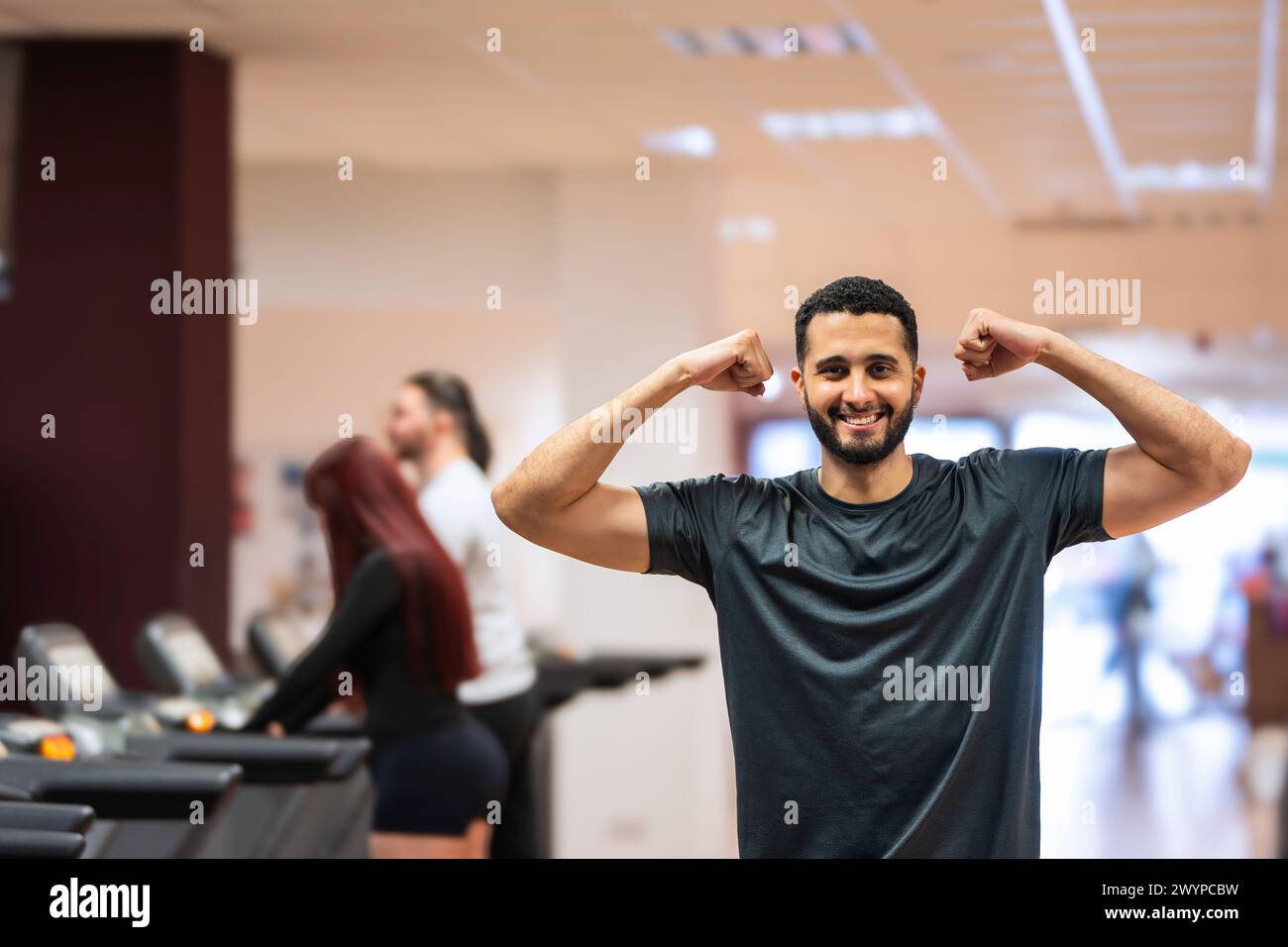Man showing off muscle hi-res stock photography and images - Alamy