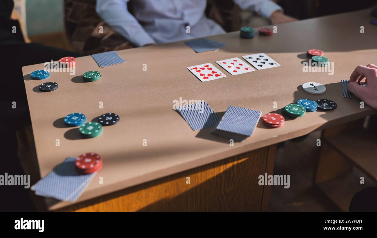 Students playing cards hi-res stock photography and images - Alamy