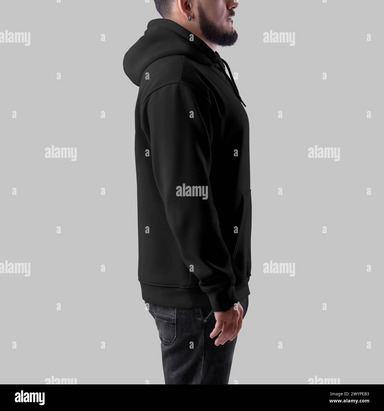 Mockup of a black oversized hoodie on a bearded man, side view, large ...