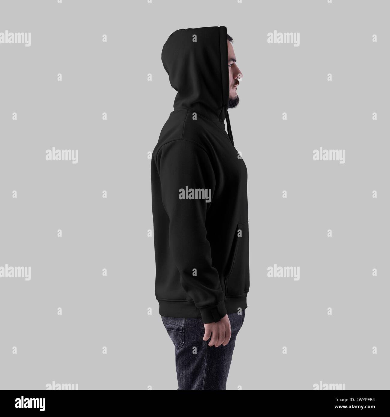 Mockup of a black oversized hoodie on a bearded man in a hood, side ...