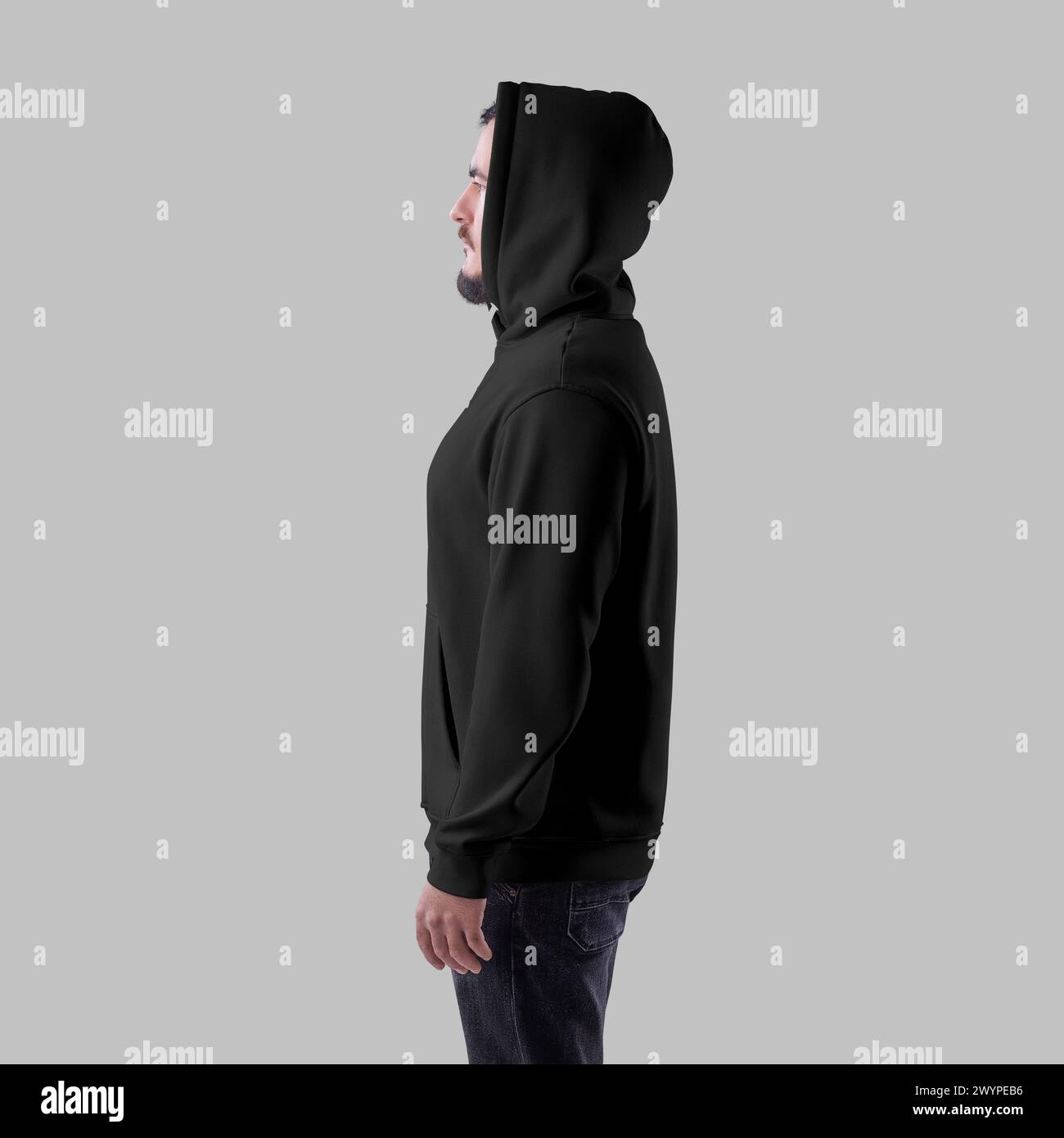 Mockup of a black oversized hoodie on a bearded man in a hood, side ...