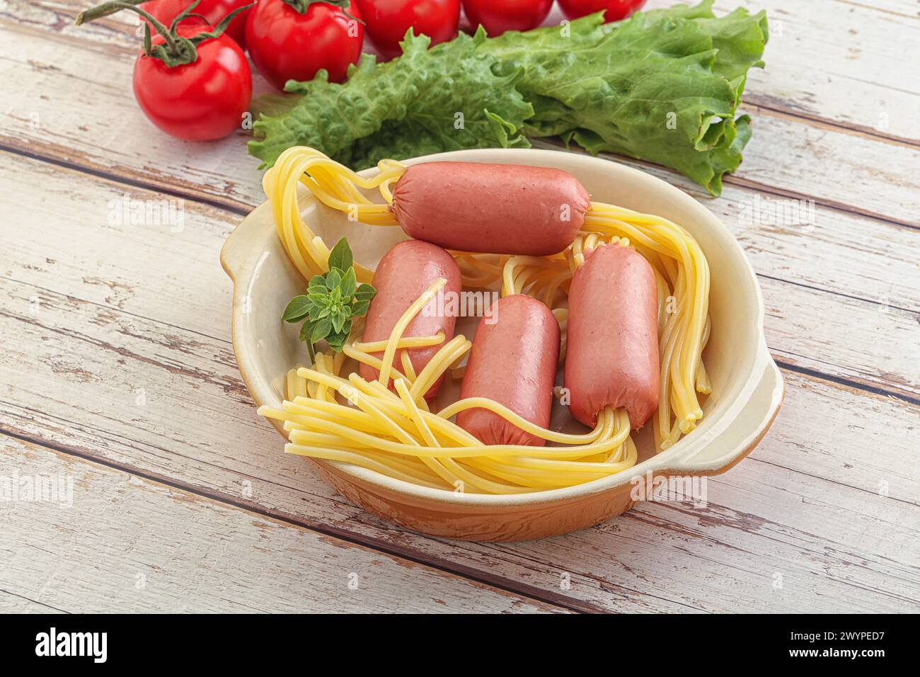 Mini sausages with pasta spaghetti for kids Stock Photo - Alamy