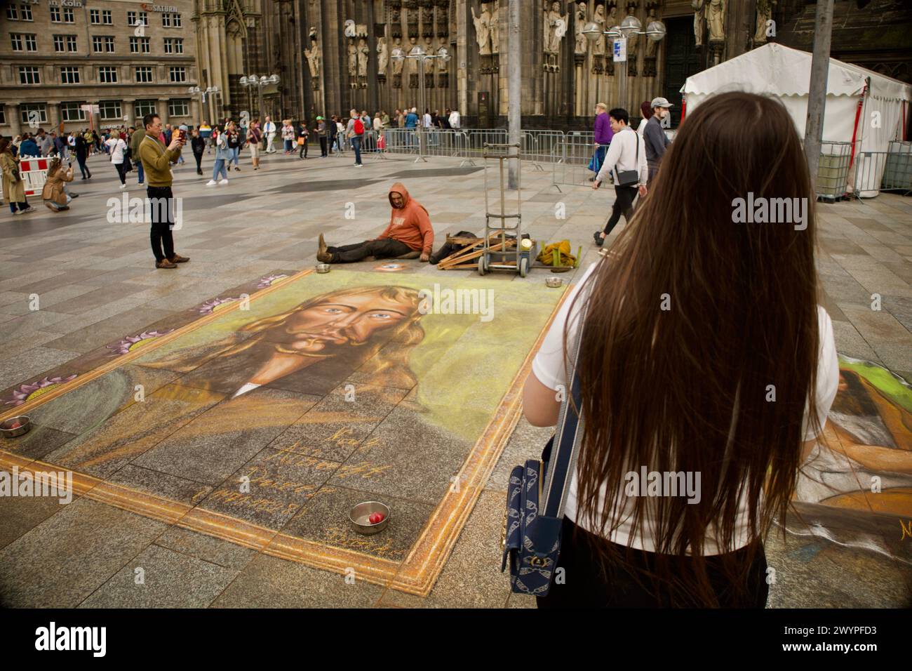 Cologne, Germany, April 07, 2024 - An artist depicts Jesus and Moses ...