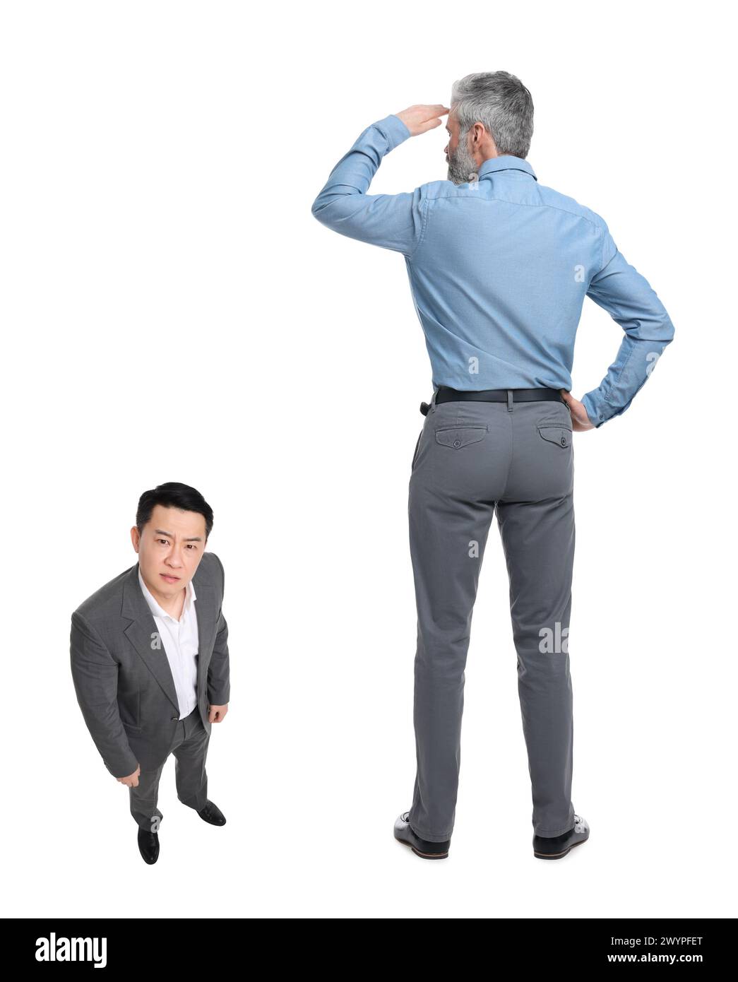 Giant boss and small man on white background Stock Photo - Alamy