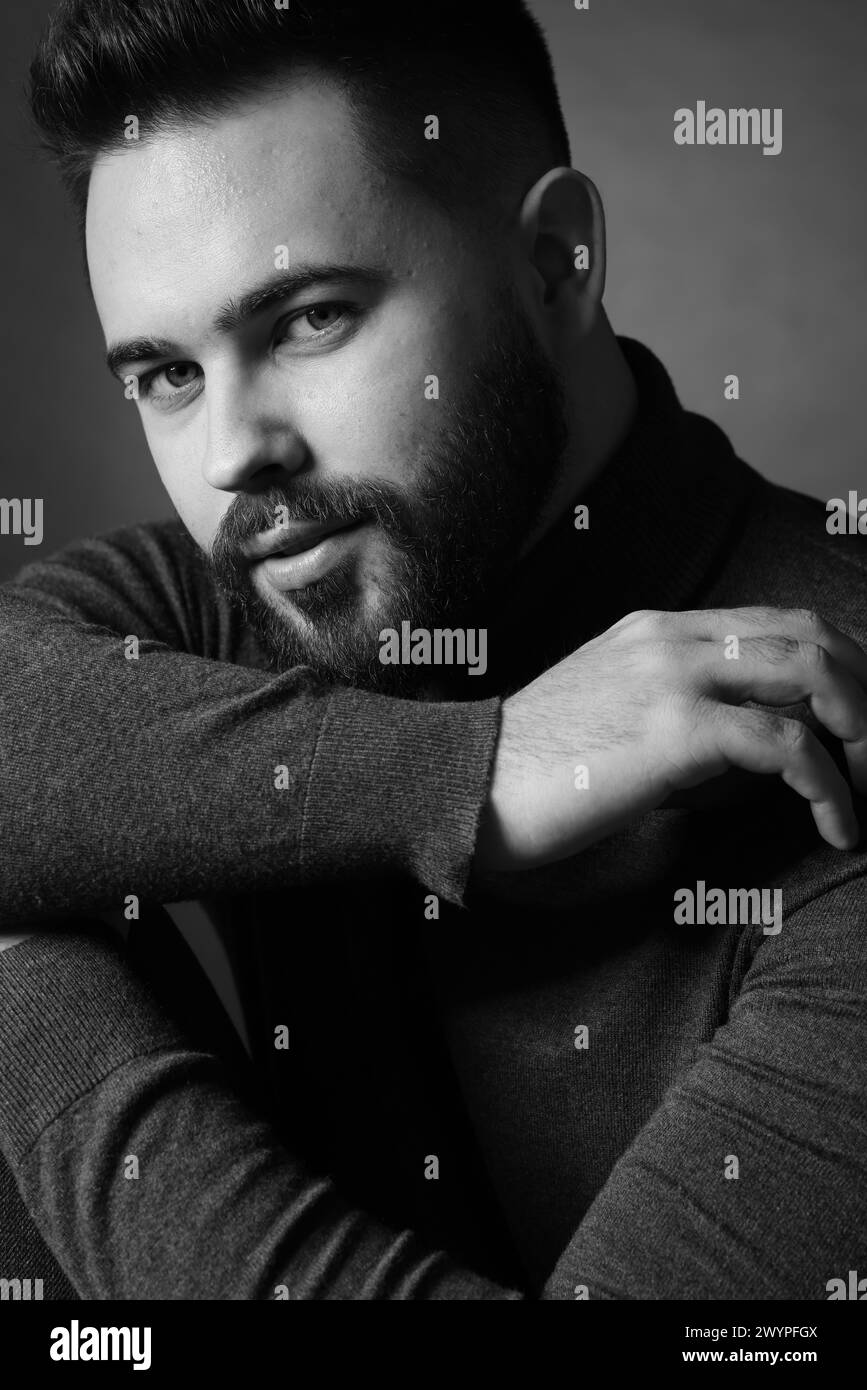 Portrait of handsome bearded man on dark background. Black and white ...