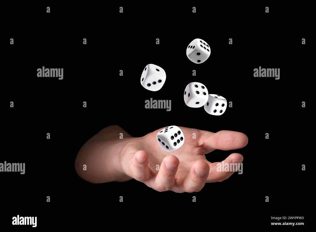 Man throwing white dice on black background, closeup Stock Photo - Alamy