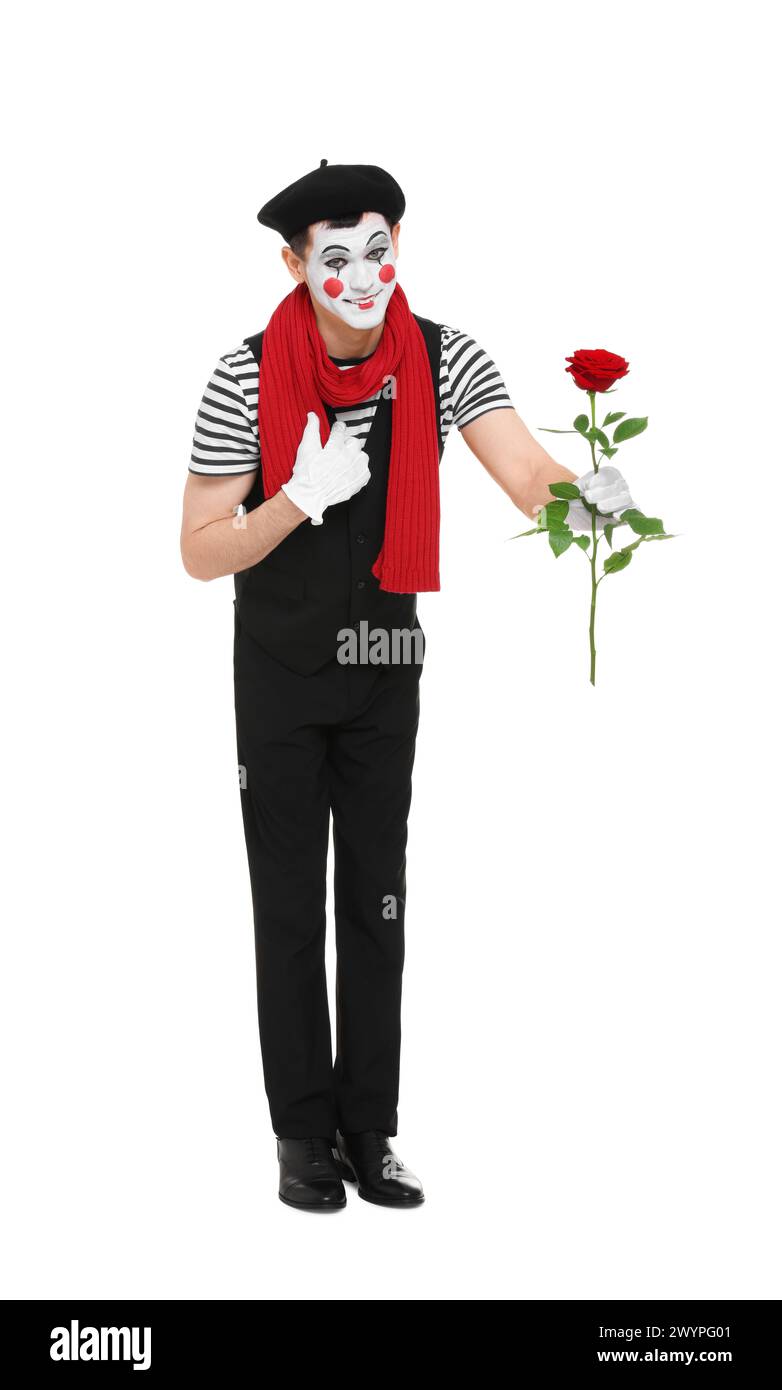 Funny mime artist with red rose posing on white background Stock Photo ...