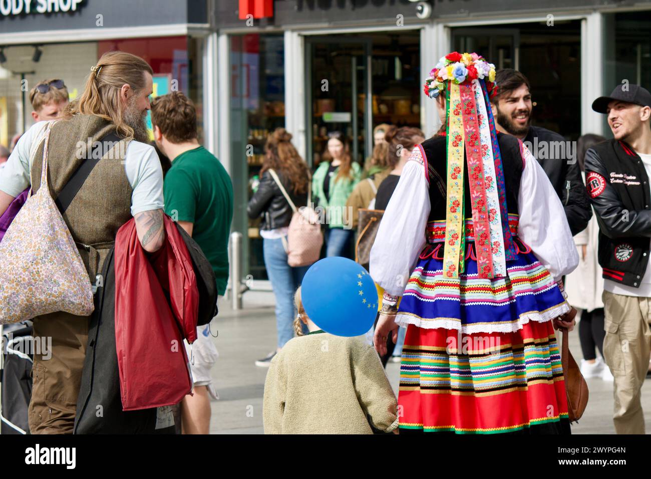 Cologne, Germany, April 07, 2024 - A woman, accompanied by her man and ...