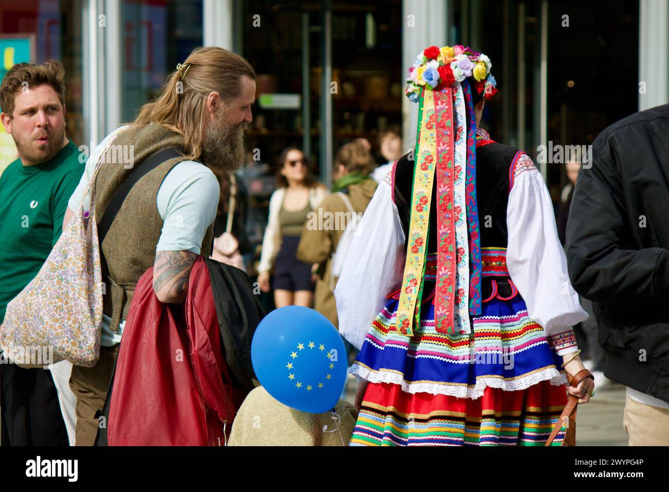 Cologne, Germany, April 07, 2024 - A woman, accompanied by her man and ...