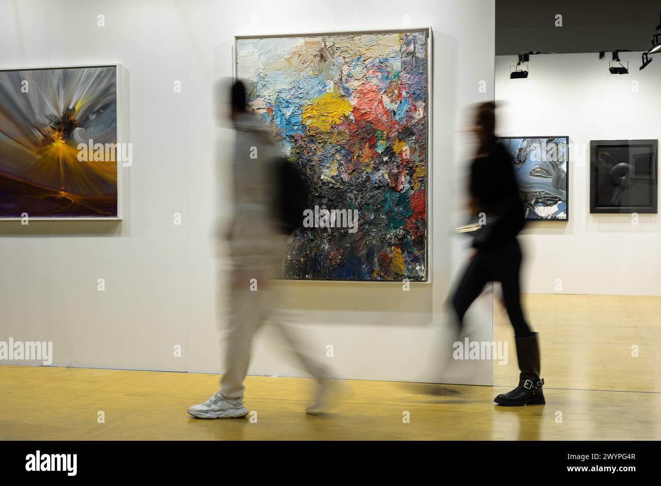 People Walking and Admiring Paintings in a Modern Art Gallery Stock ...
