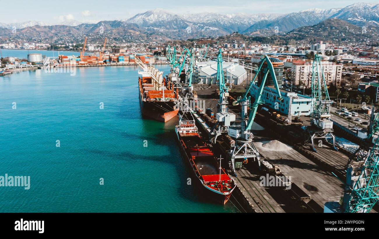 Aerial view of an industrial port with cargo ships and cranes, set ...