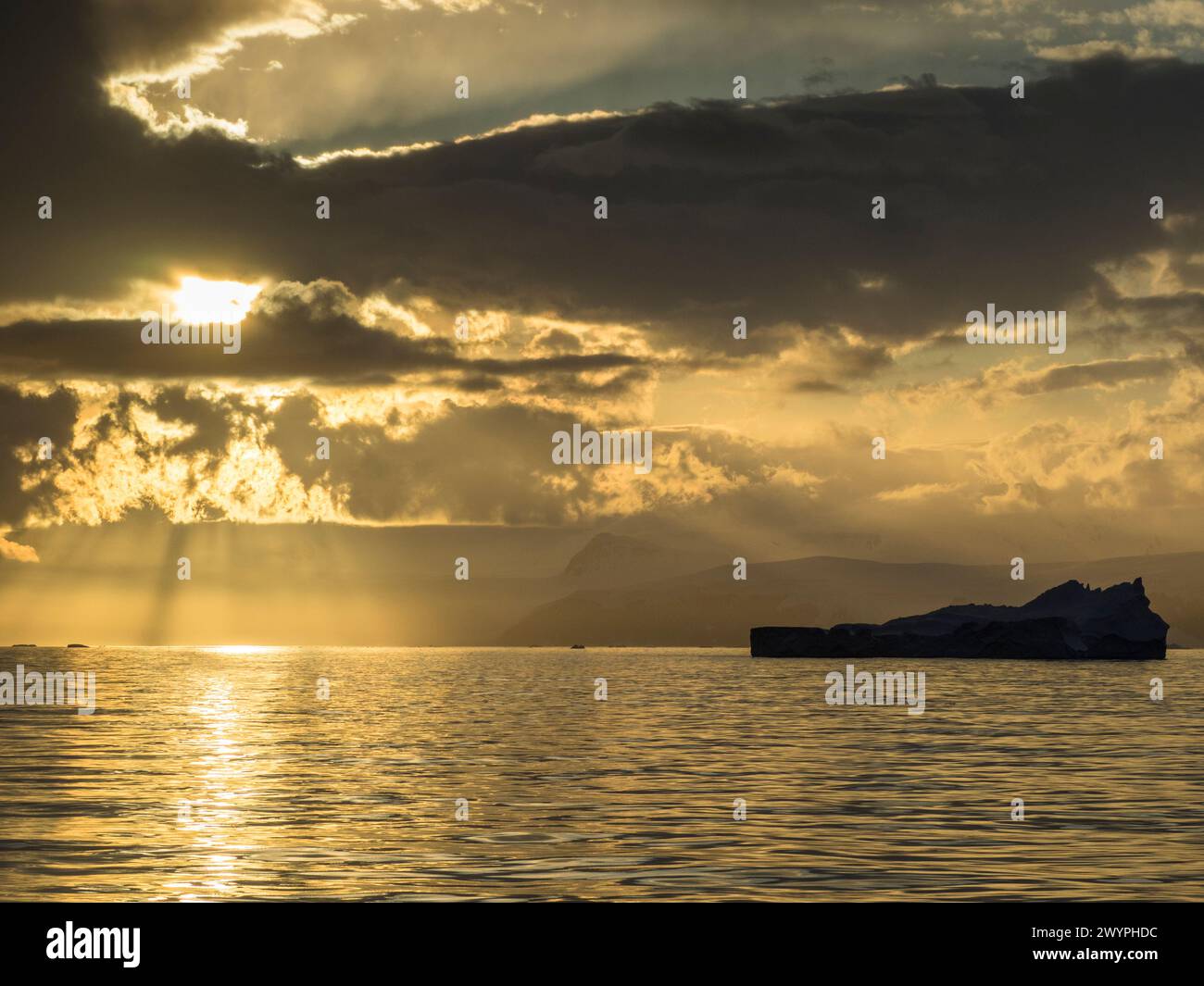 Dramatic sky over an iceberg in the Orleans Strait off the Davis Coast ...