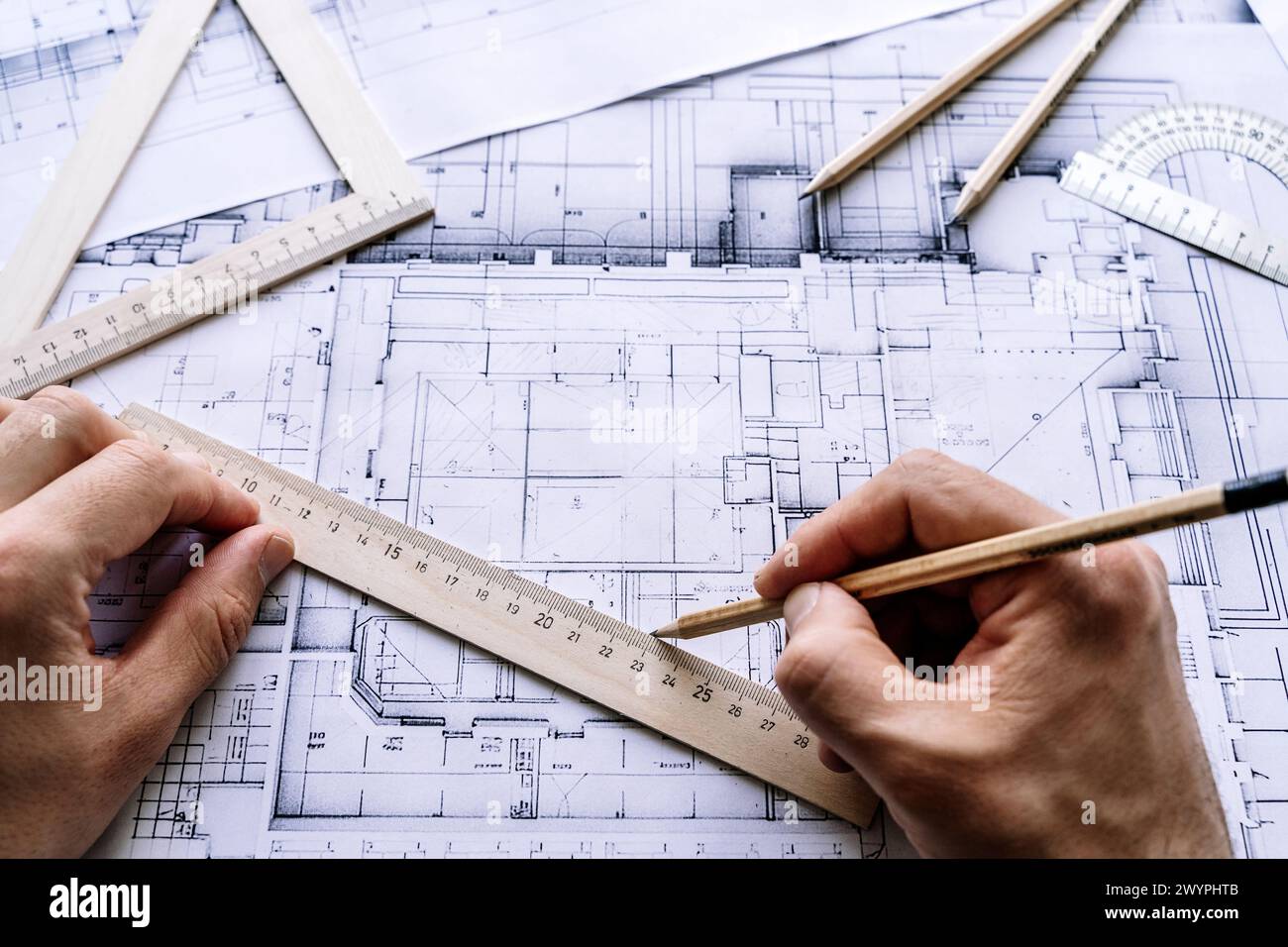 Architectural engineering design plan drawing on the table. Architect's ...