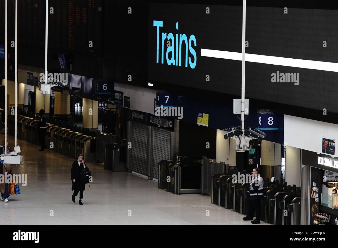 Passengers on a near-empty concourse at Waterloo train station in ...