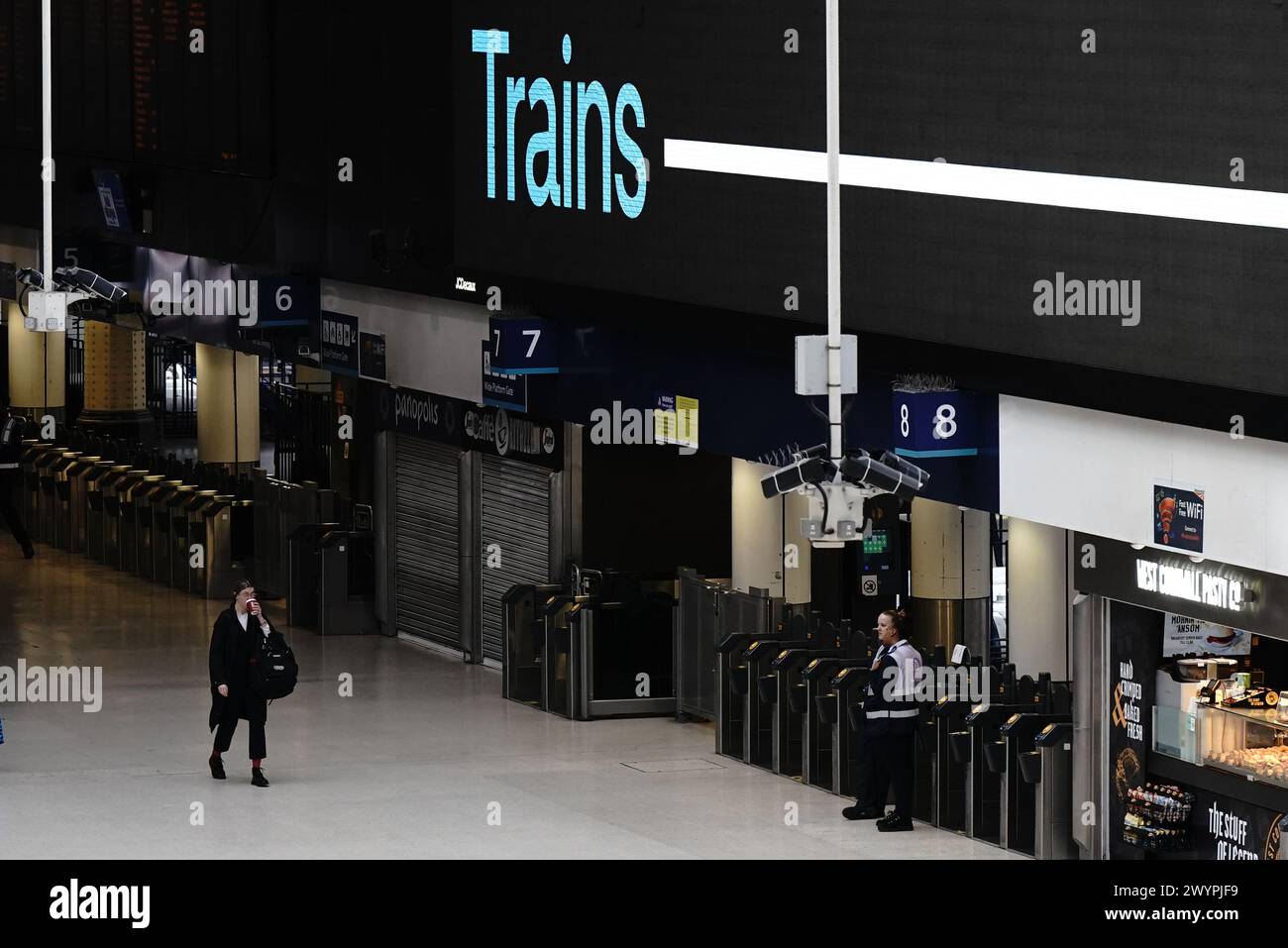 A near-empty concourse at Waterloo train station in London, as members ...