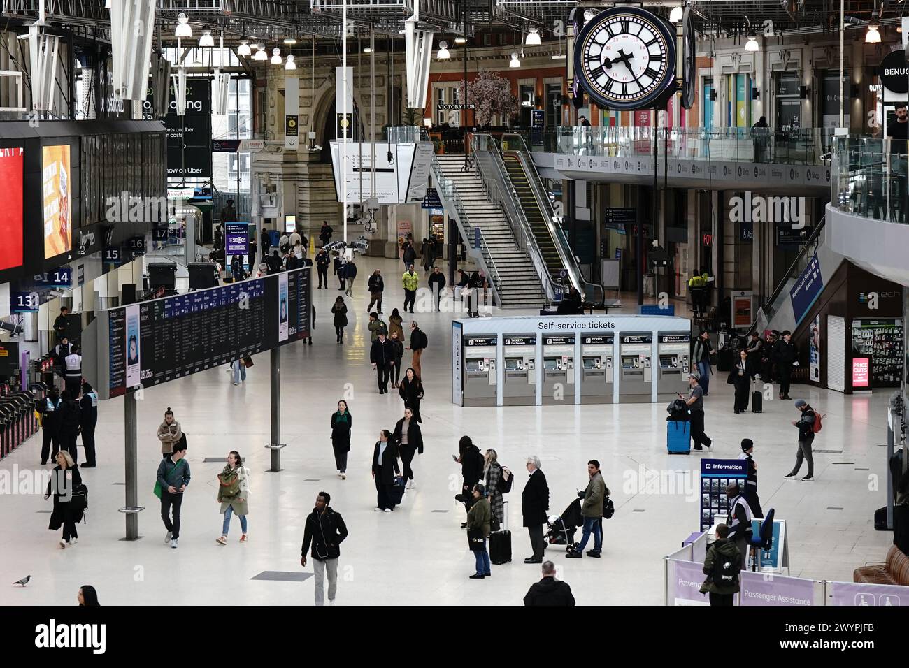 Passengers at Waterloo train station in London, as members of train ...