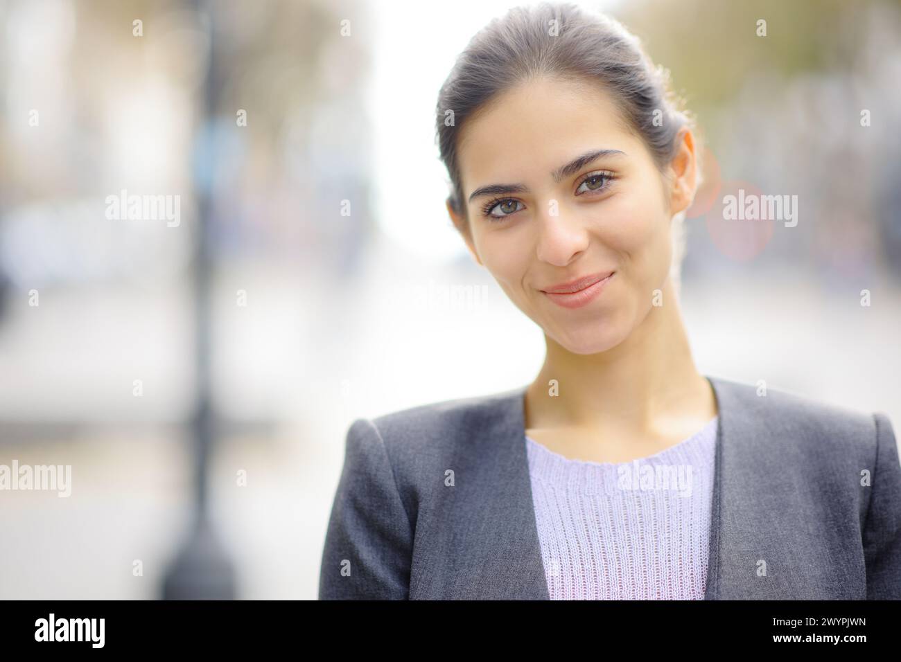 Front view portrait of a proud executive looking at you in the street ...
