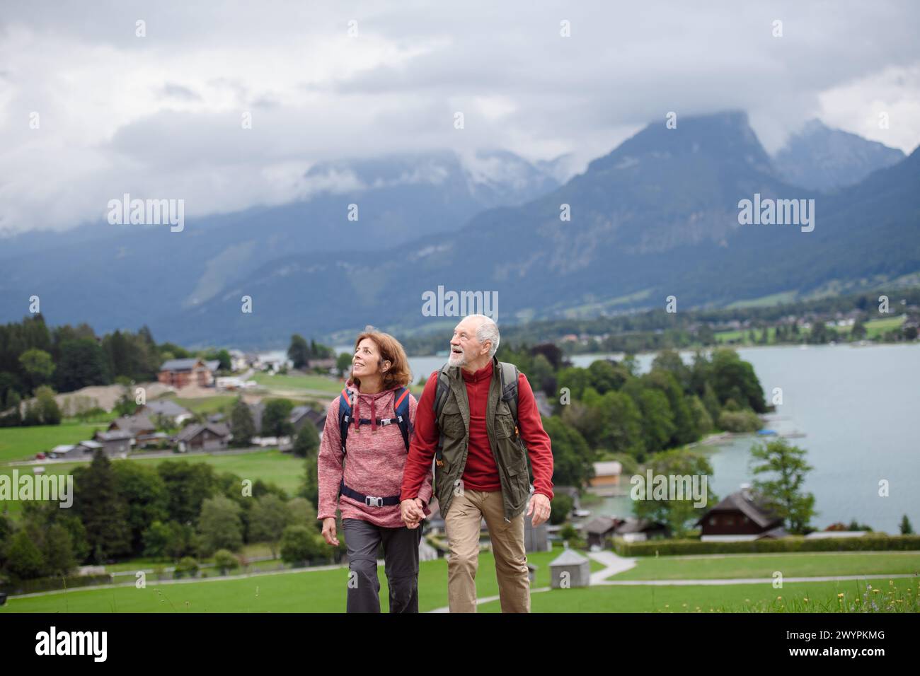 Active elderly couple on trip together, during spring day. Senior ...