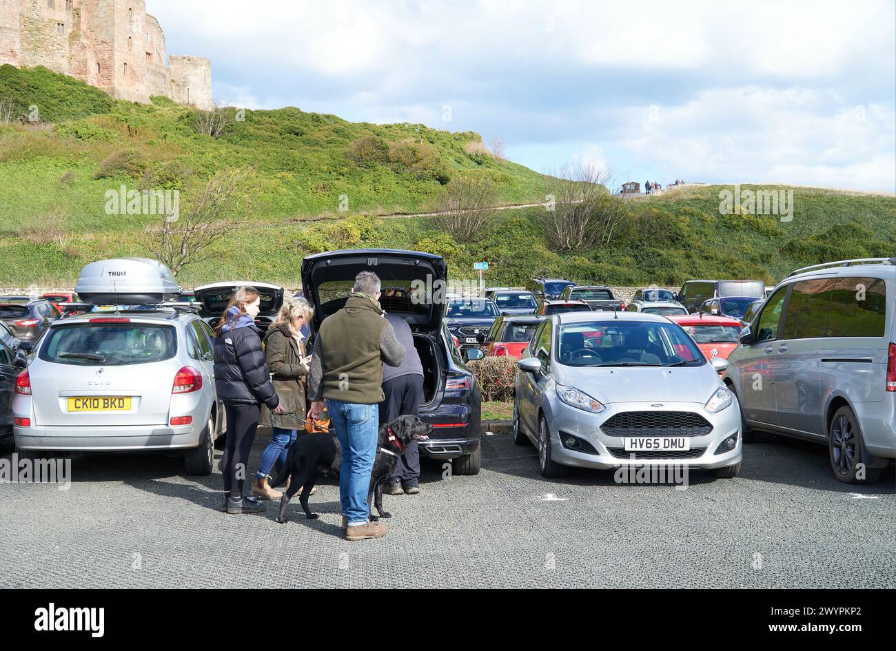 Family day out at Bamburgh Castle, UK Stock Photo - Alamy