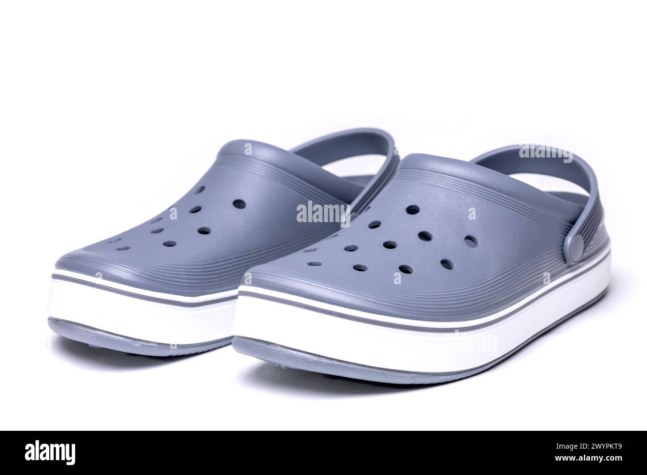 Gray crocs on a white background. Rubber shoes Stock Photo - Alamy