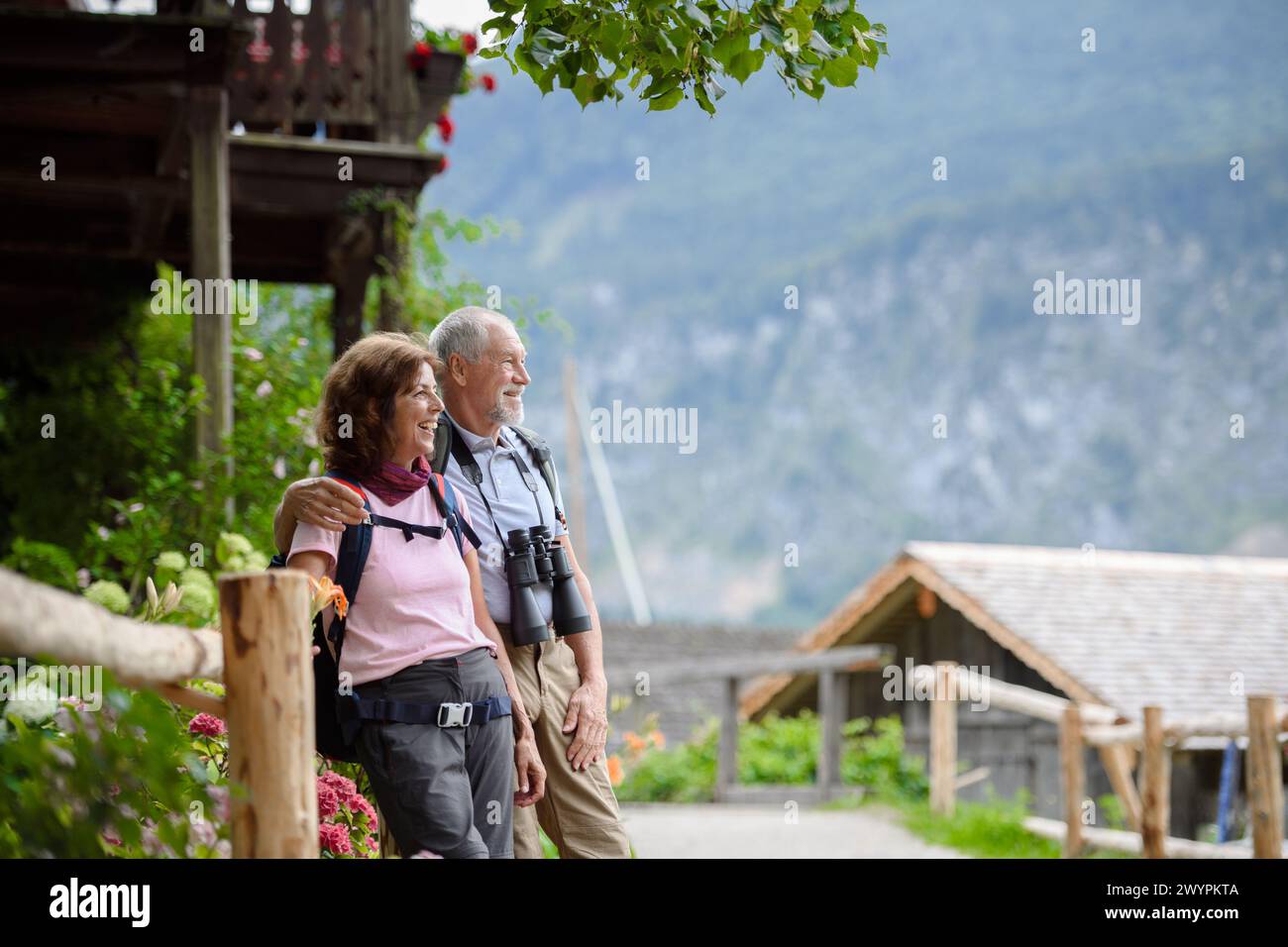 Active elderly couple on trip together, during spring day. Senior ...
