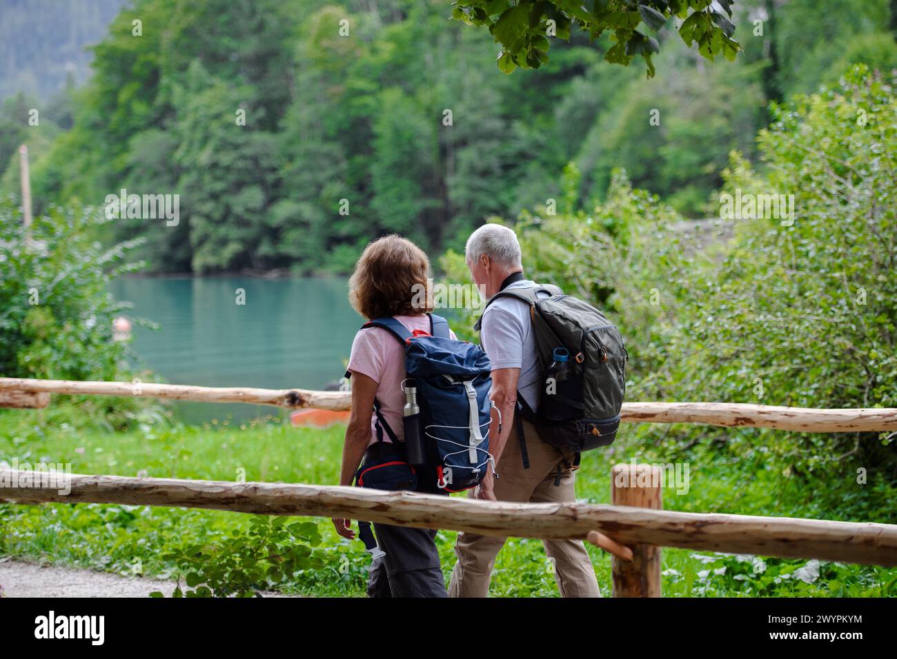 Active elderly couple on trip together, during spring day. Senior ...