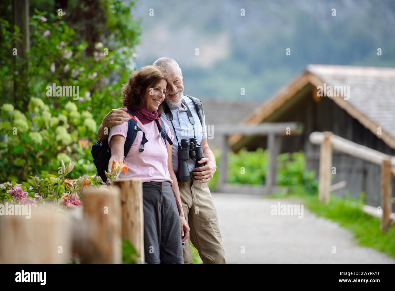 Active elderly couple on trip together, during spring day. Senior ...