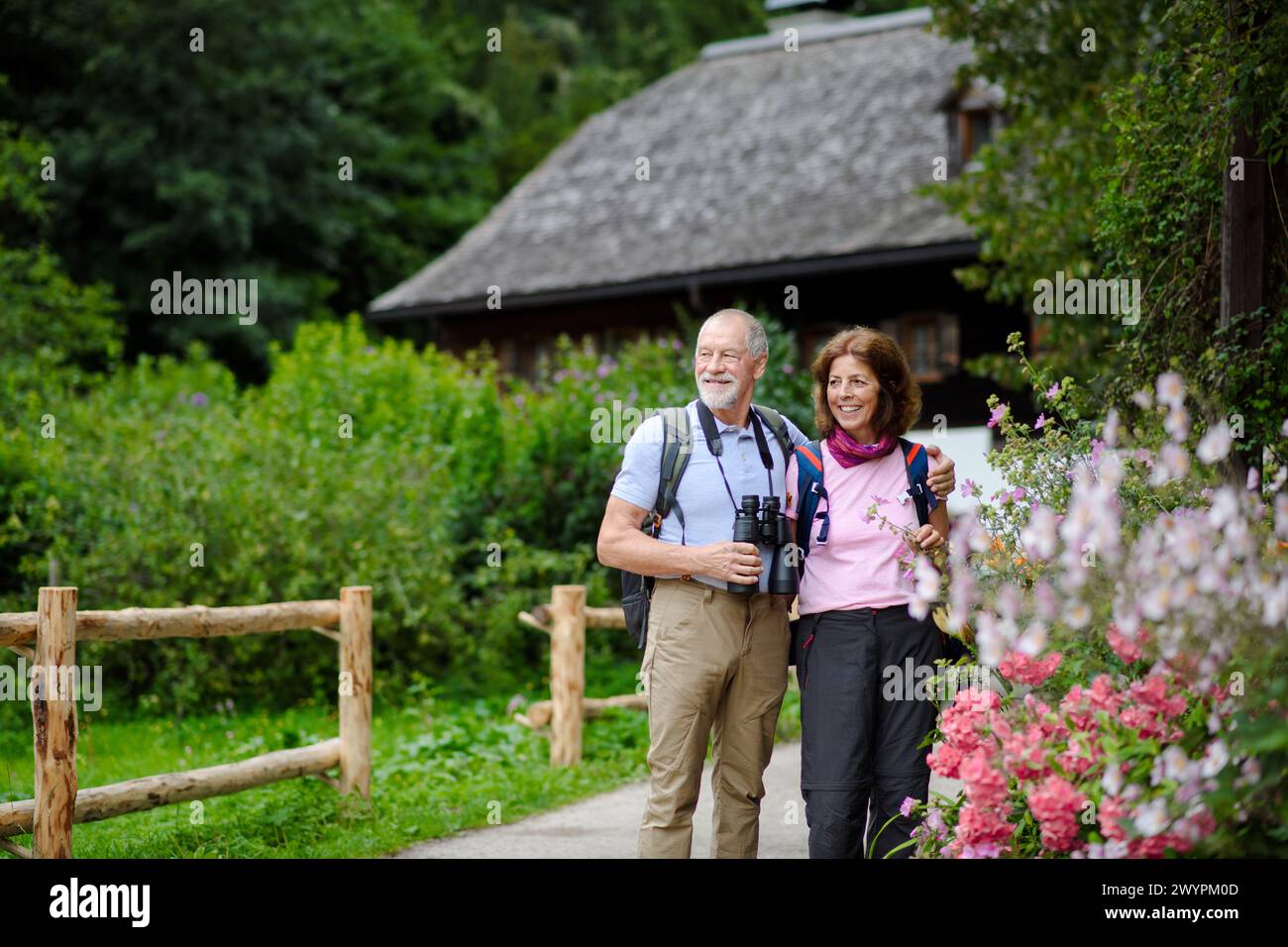 Active elderly couple on trip together, during spring day. Senior ...